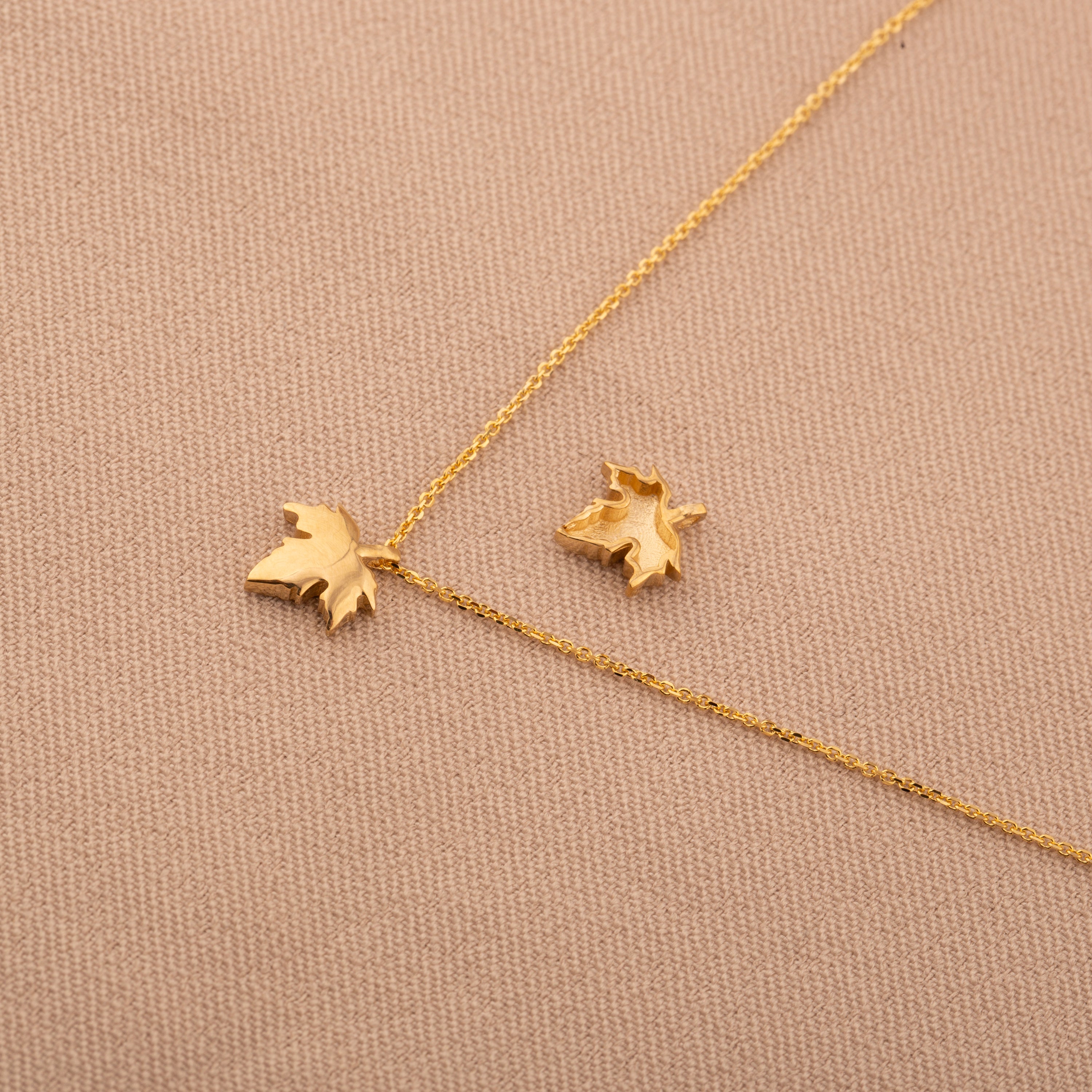 Gold maple leaf pendant store